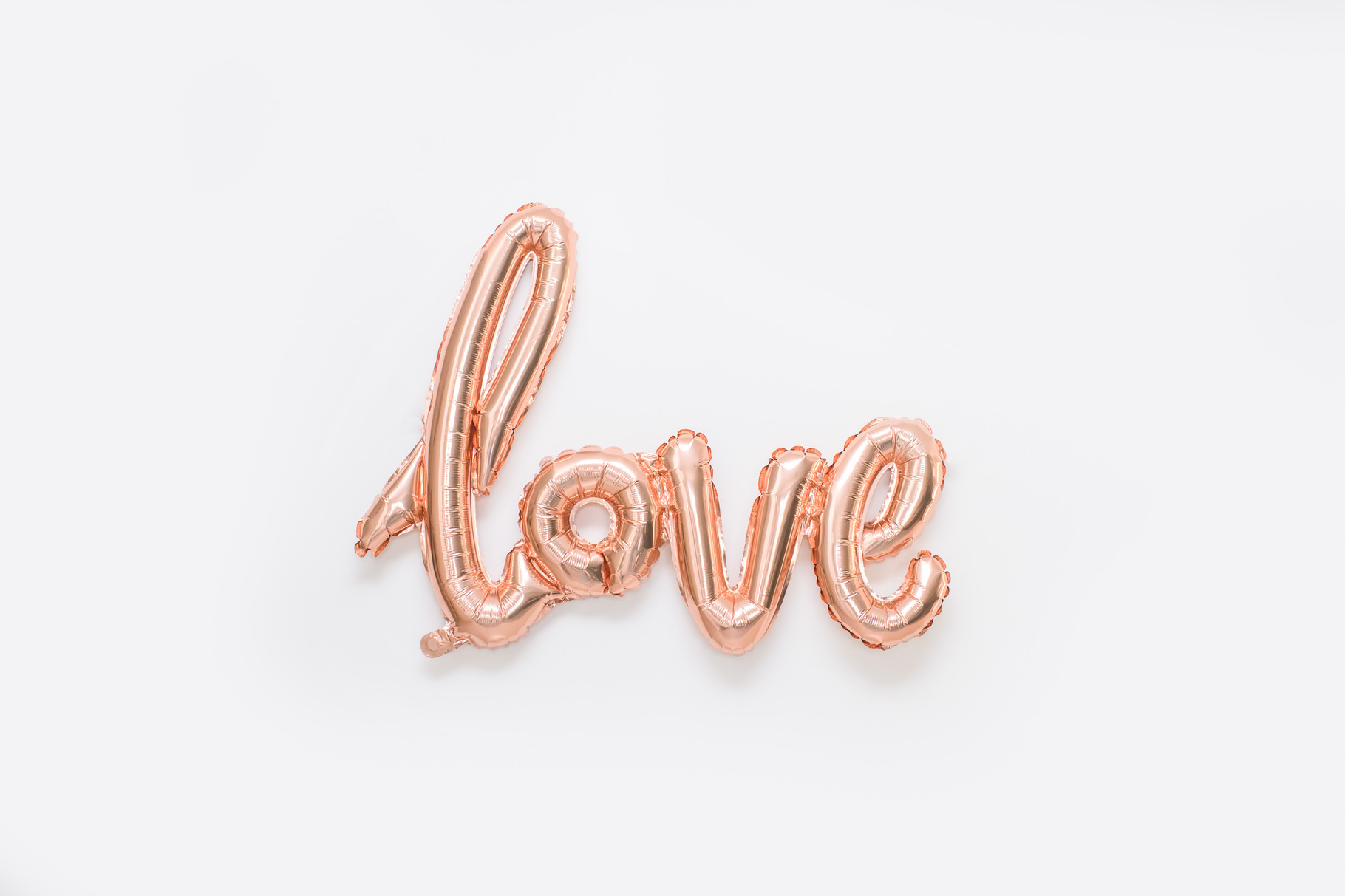 LOVE Rose Gold Foil Balloon, a Background Photo by Janelle Keys