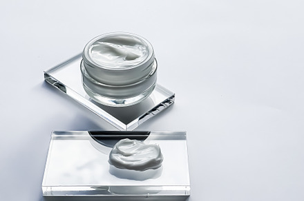 Face cream moisturiser jar and product sample on glass, beauty a, a ...