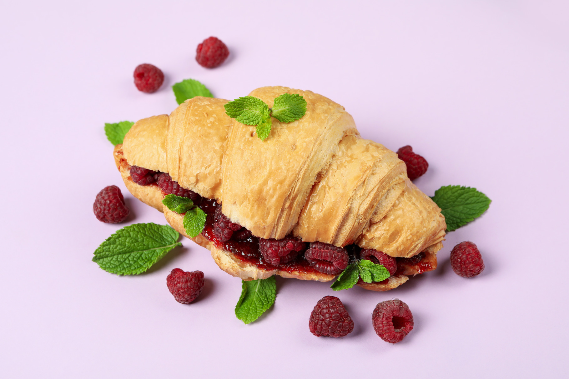 Croissant with raspberry jam on purple background, a Food & Drink Photo ...