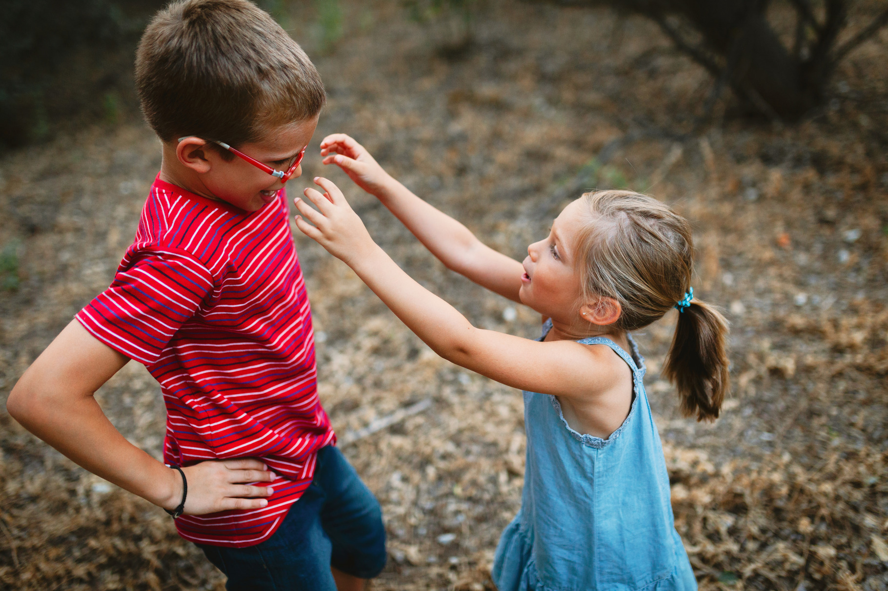 Two kids playing and dancing in the containing two kids, playing, and ...