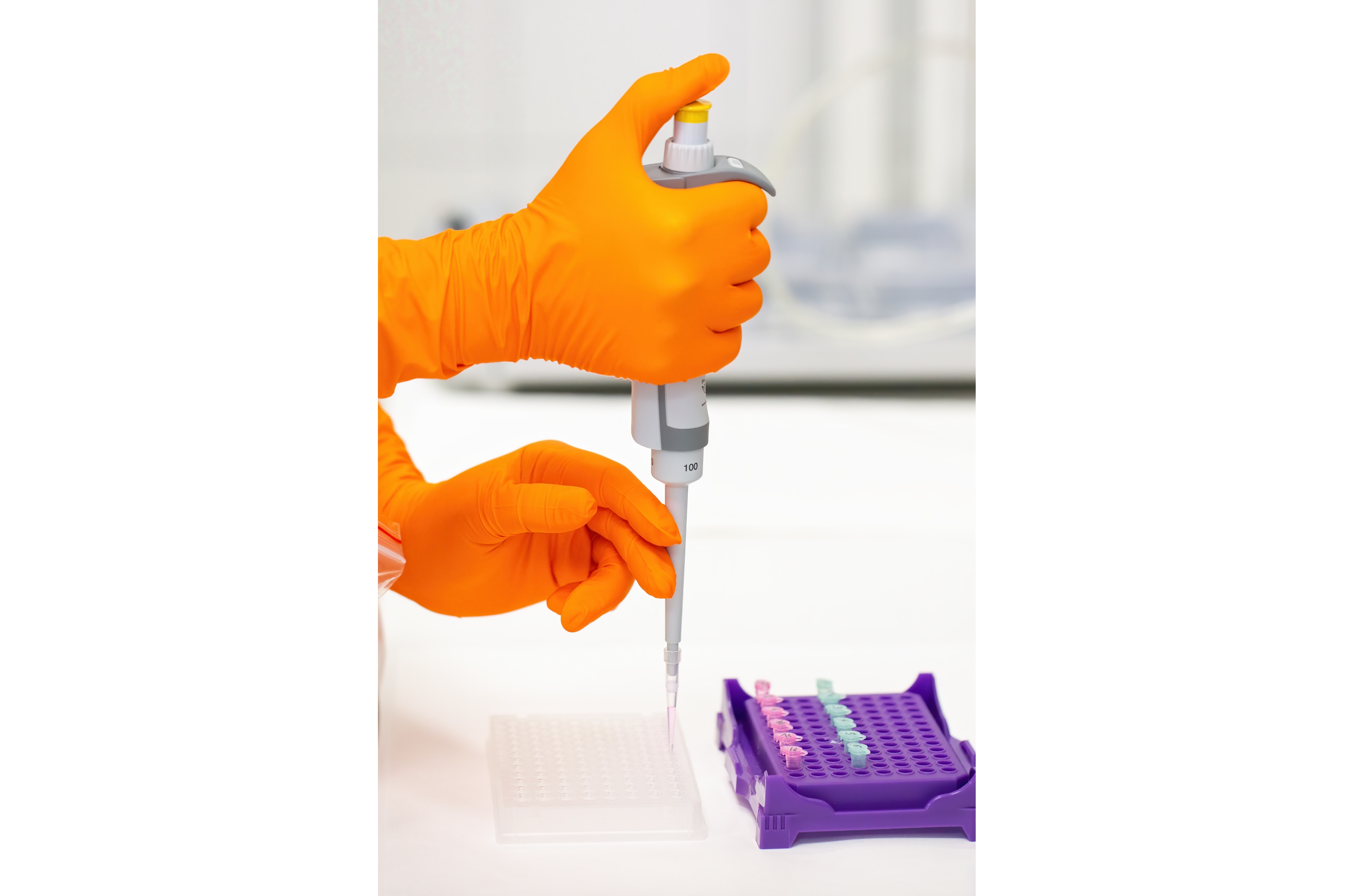 Person holding a pipette in hand and, a Technology Photo by WildMedia
