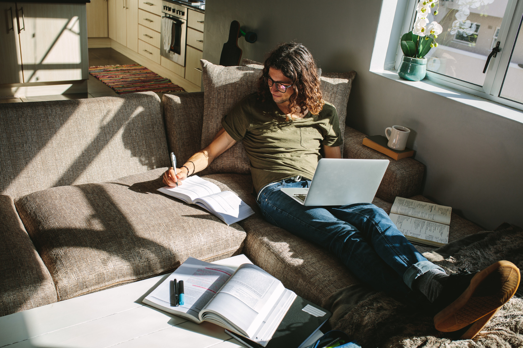 Student studying at home sitting featuring academics, beside, and books ...