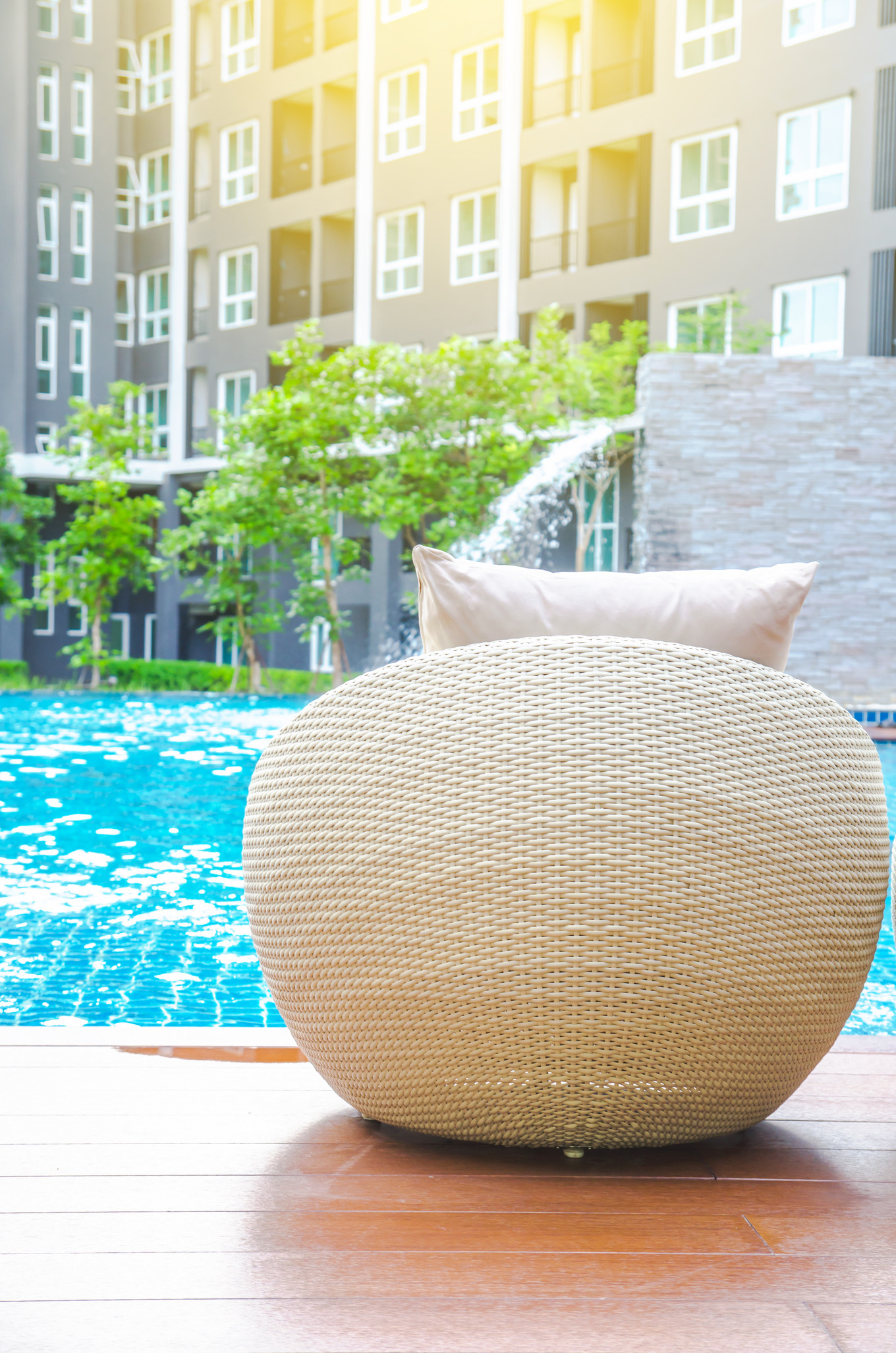 Rattan sofa featuring pool, bed, and resort, an Architecture Photo by ...