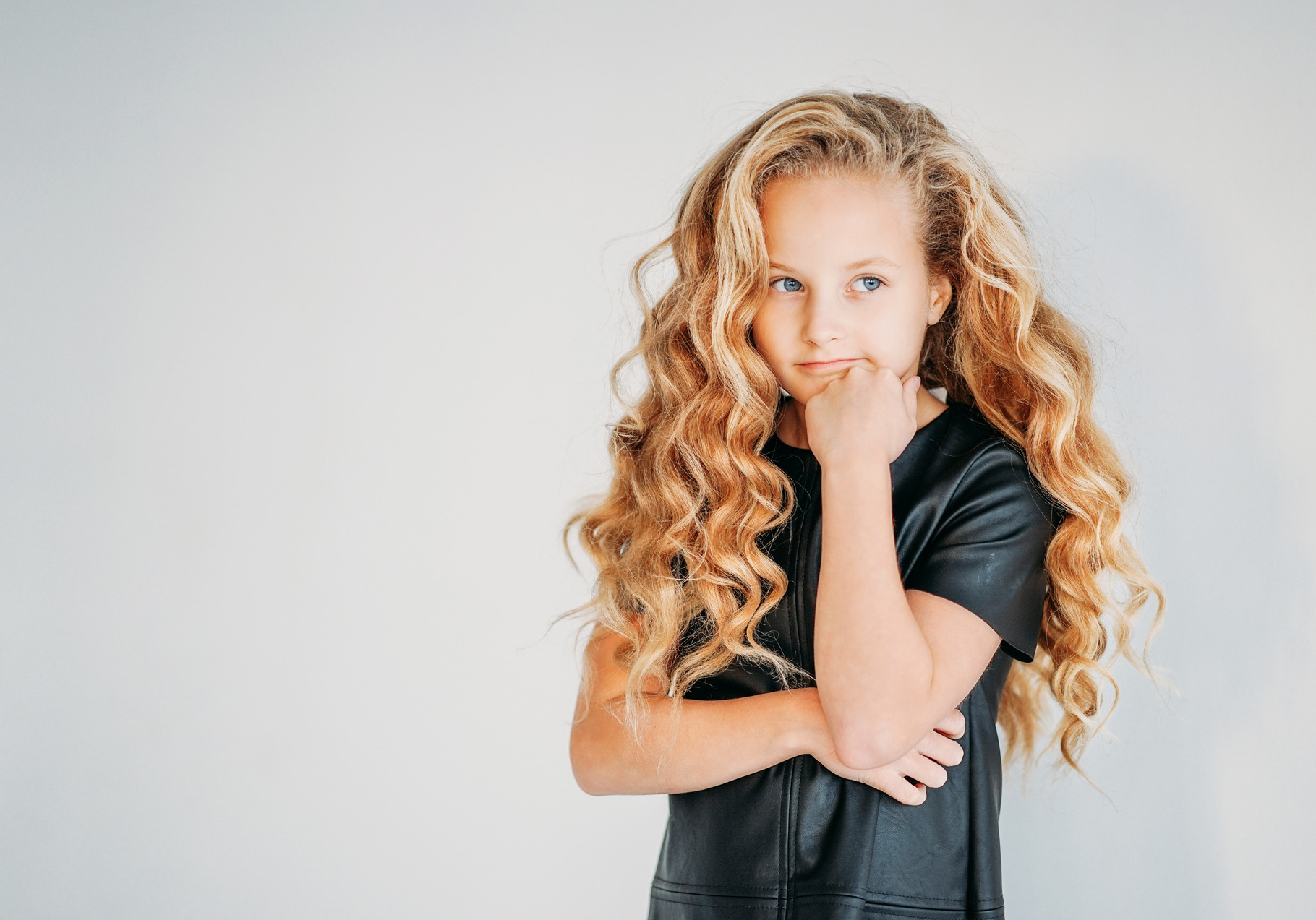 Thinking curly hair tween girl, a Person Photo by Galina_Zhigalova