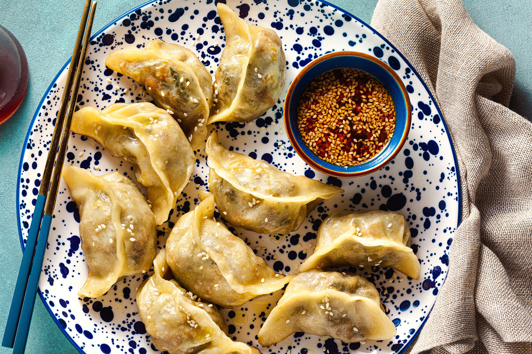 Wonton dumplings with spicy sesame s featuring dim sum, group, and dip ...