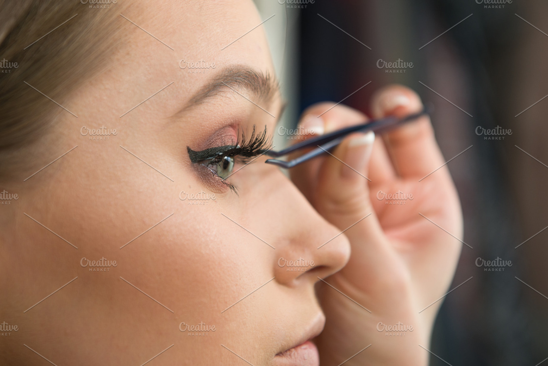 Woman apply fake eyelashes featuring false, eyelashes, and eyelash, a ...