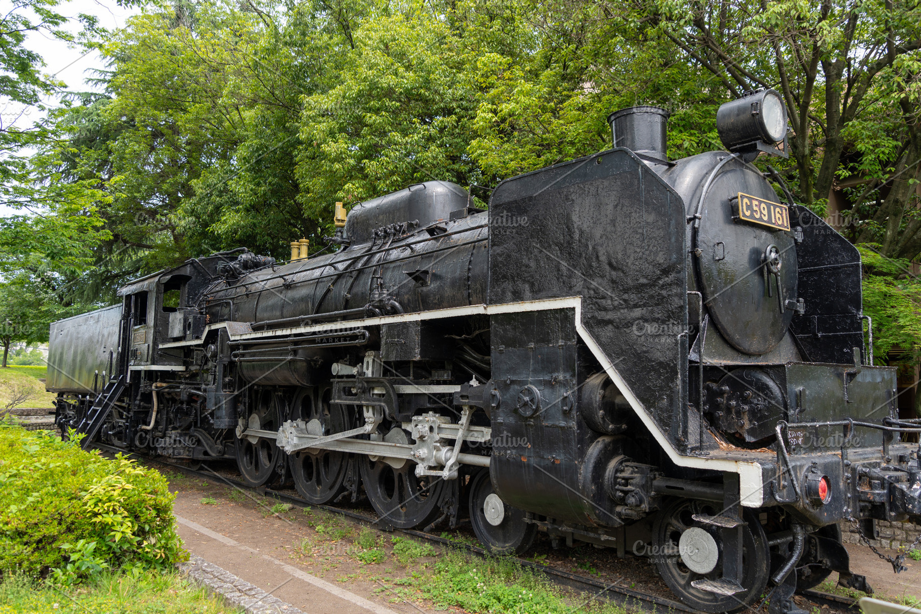 Old steam locomotive C59 161 in a Hiroshima city park, a Transportation ...