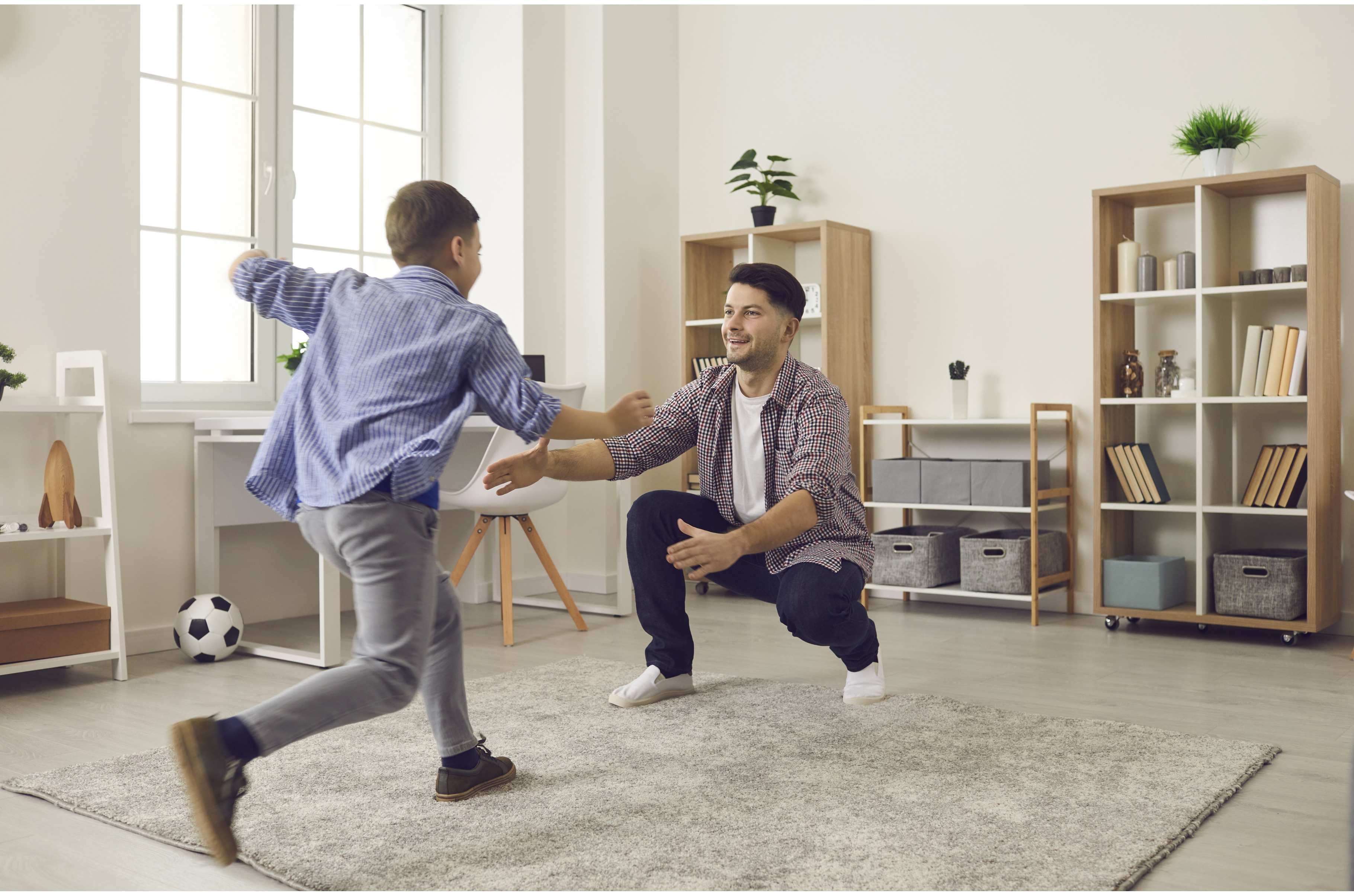 Happy little son running to hug his, a Person Photo by StudioRomantic
