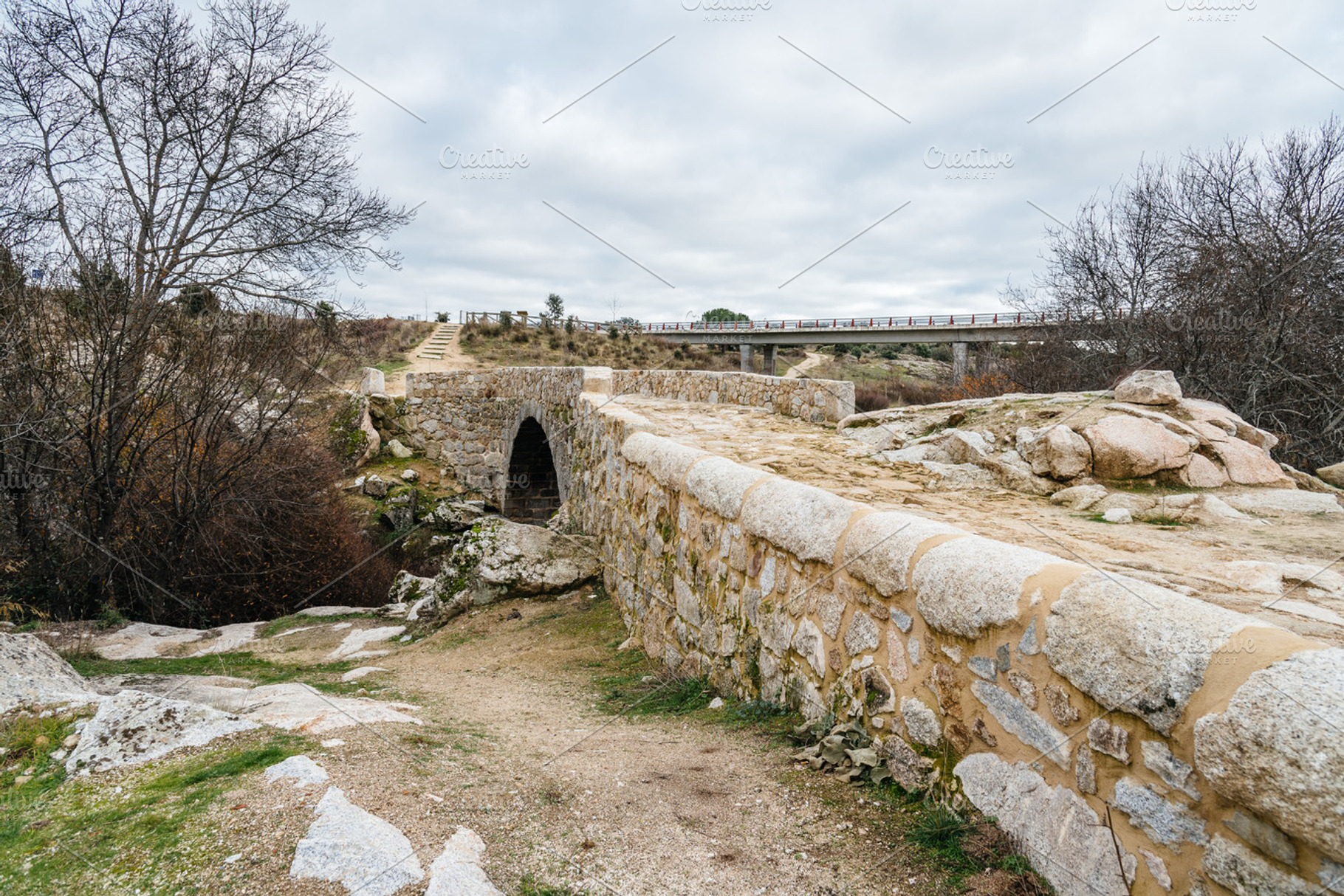 Medieval stone bridge featuring boulder, bridge - built structure, and ...