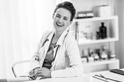 Portrait of laughing medical doctor woman sitting in office | Health ...