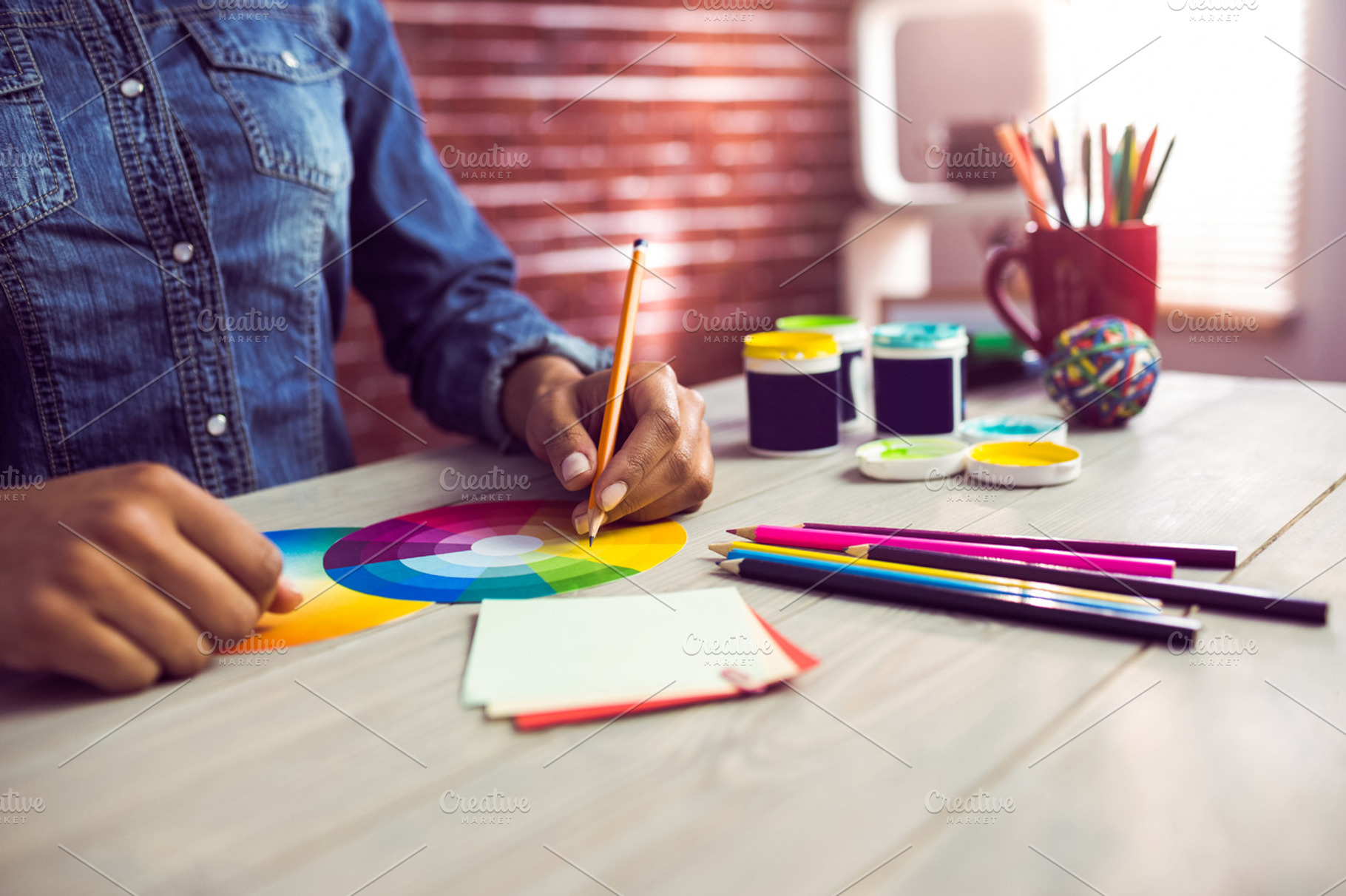 Graphic designer drawing on colour chart, a Background Photo by ...