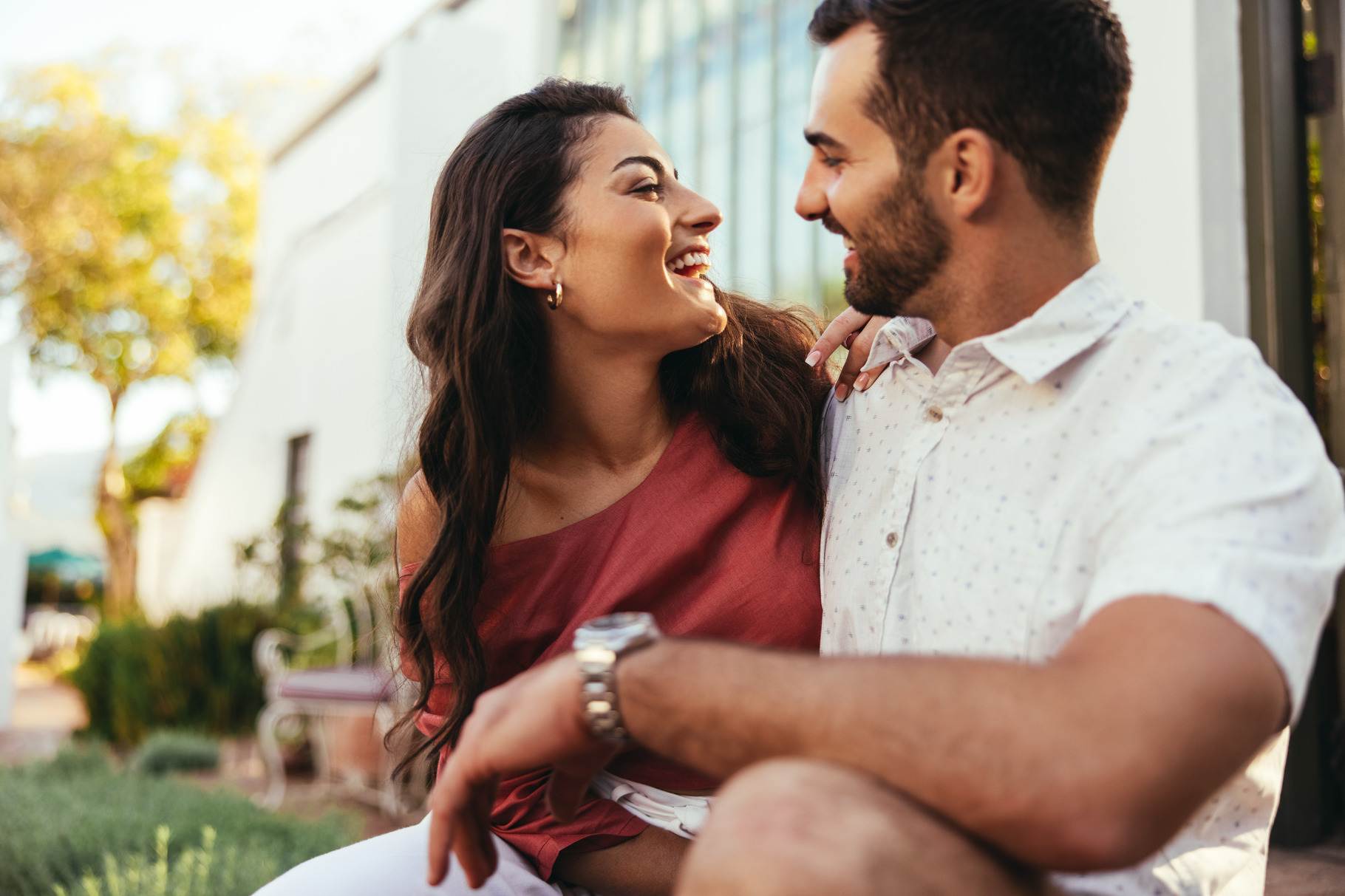 Couple laughing together outside a hotel, a Person Photo by Jacob Lund
