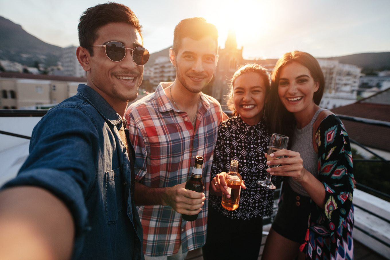 Young friends partying together containing balcony, celebration, and ...