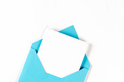 open blue envelope with paper sheet, a Background Photo by vimart
