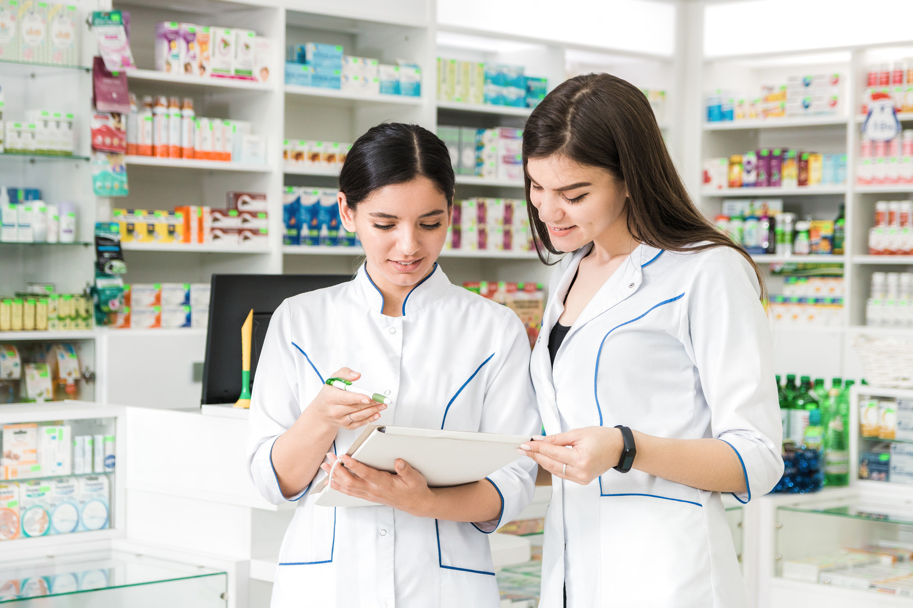 two beautiful women pharmacist, a Health & Medical Photo by AD Stock Images
