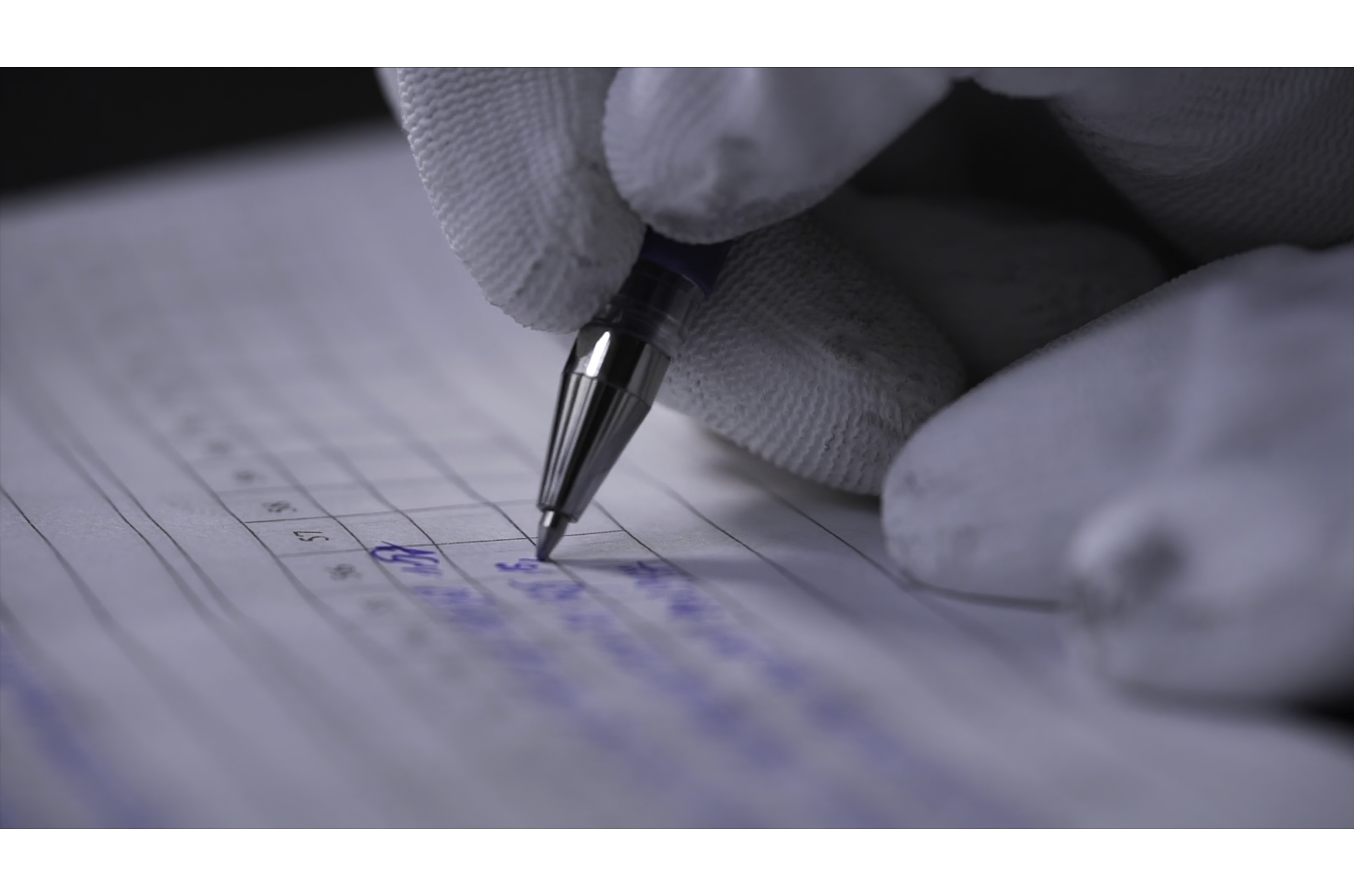 Side view of a hand making notes in, a Background Graphic by Media ...