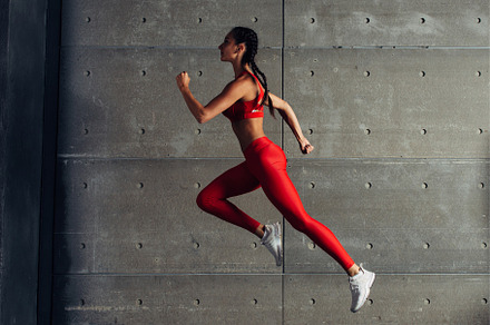 Fit young woman jumping and running featuring activity, athlete, and ...