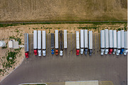 Aerial top view semi truck with, a Transportation Photo by Ungvar Studio