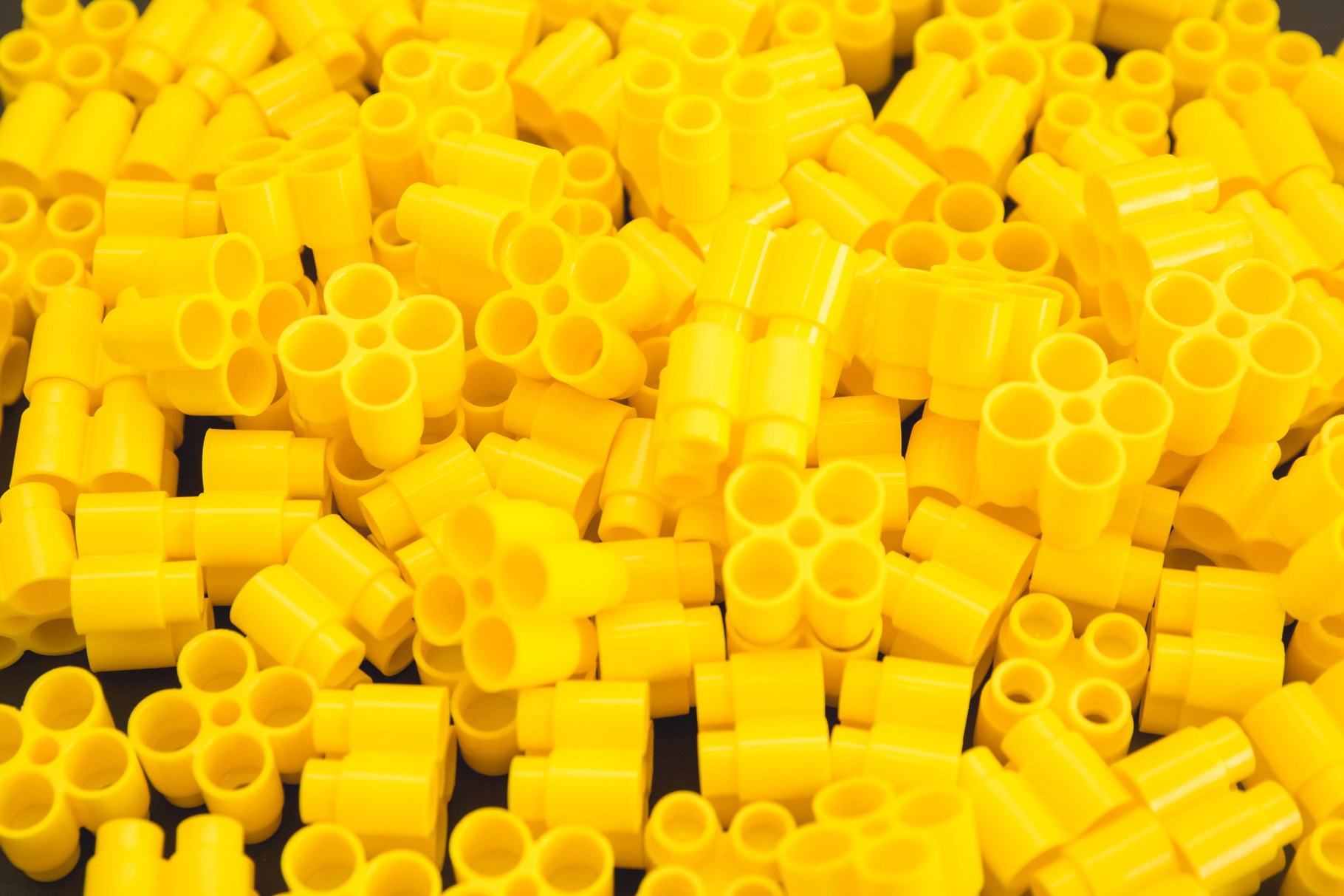 Plastic bricks of yellow color and featuring activity, background, and ...