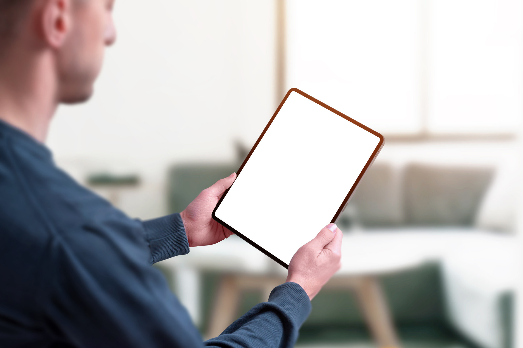 Man hold iPad Pro tablet mockup, an iPad Mockup by RSplaneta