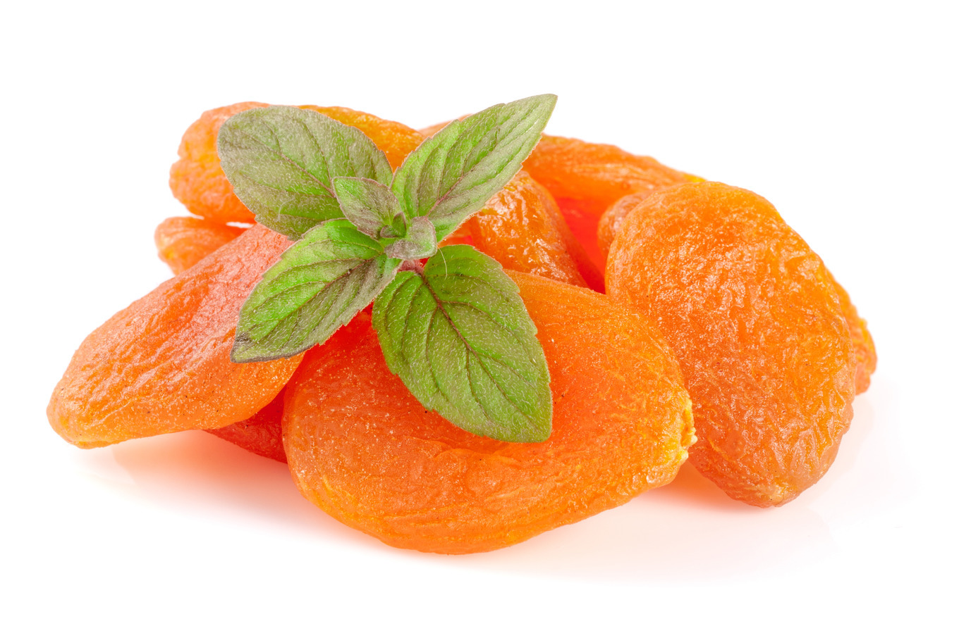 Dried apricots with mint leaves isolated on white background featuring ...