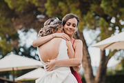 Bridesmaid hugging the bride at the wedding, a Person Photo by rubenchase