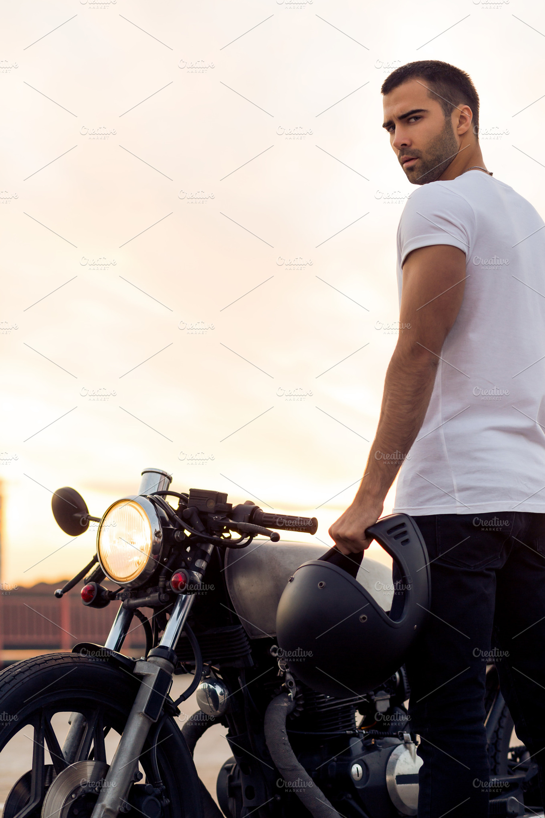 Handsome man and cool caferacer bike featuring style, male, and beard ...