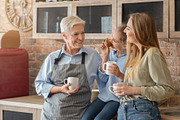 Family of three drinking tea and tal, a Photo by Prostock-Studio