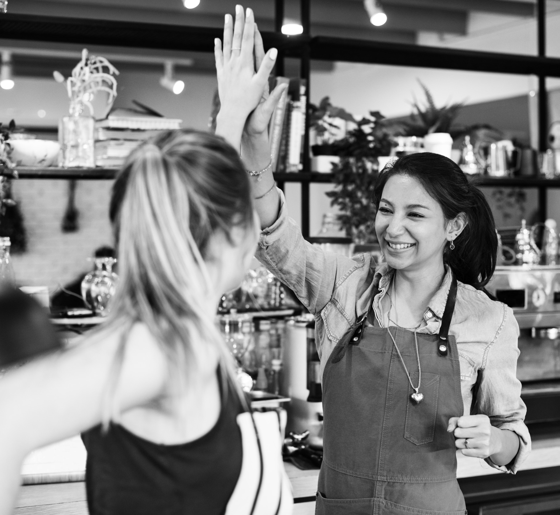 Women give a high five to each other, a Person Photo by rawpixel