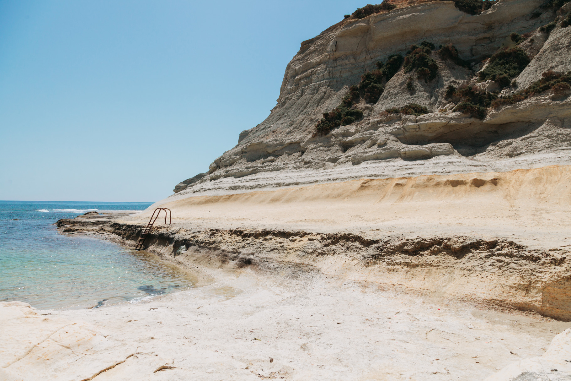 Rusty ladder in a lonely beach featuring summer, ladder, and ocean, a ...