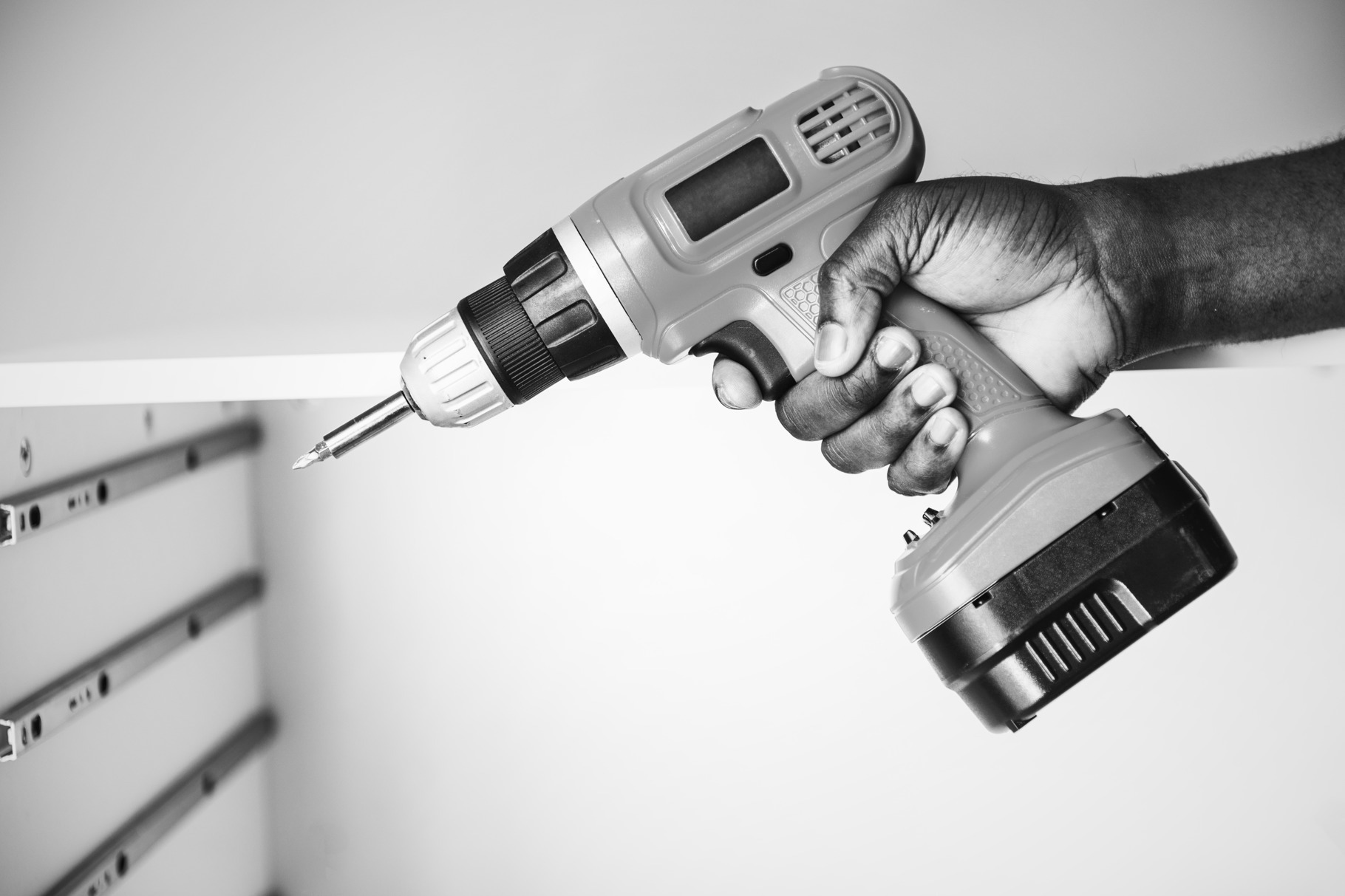 Man using an electronic drill, a Photo by rawpixel