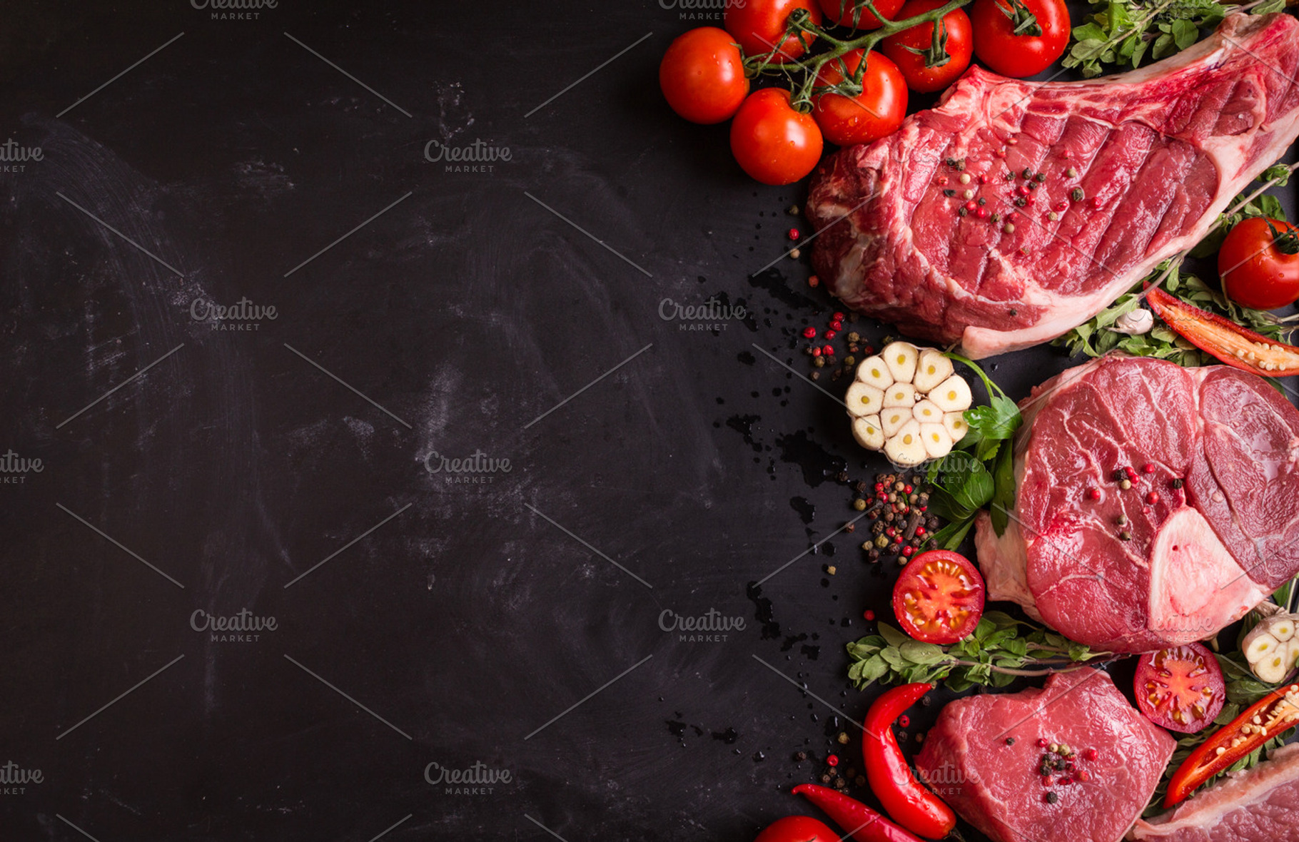 Raw meat steaks on a dark background, a Food & Drink Photo by its_al_dente