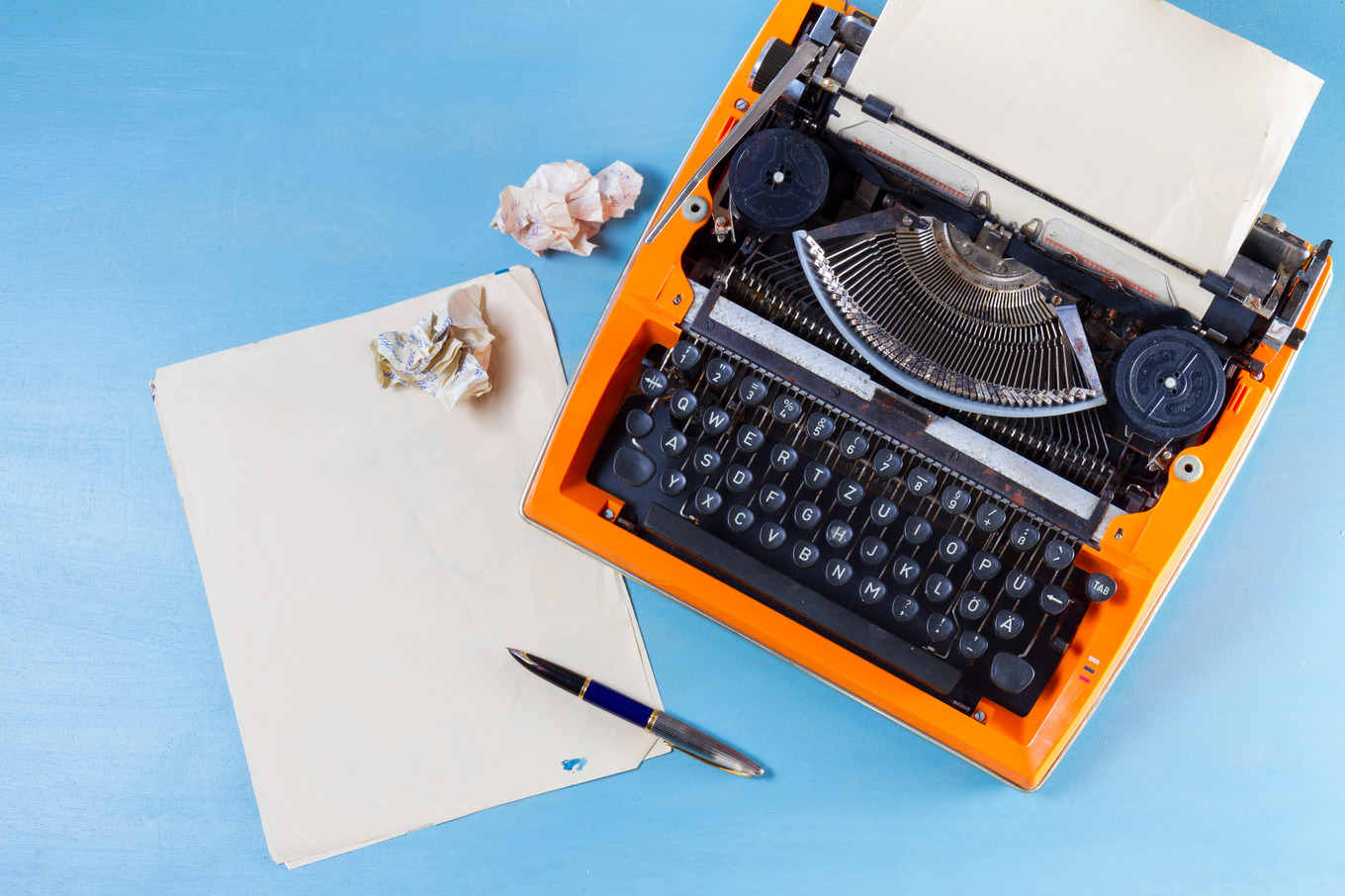 Workspace with vintage orange typewriter featuring typewriter, vintage ...