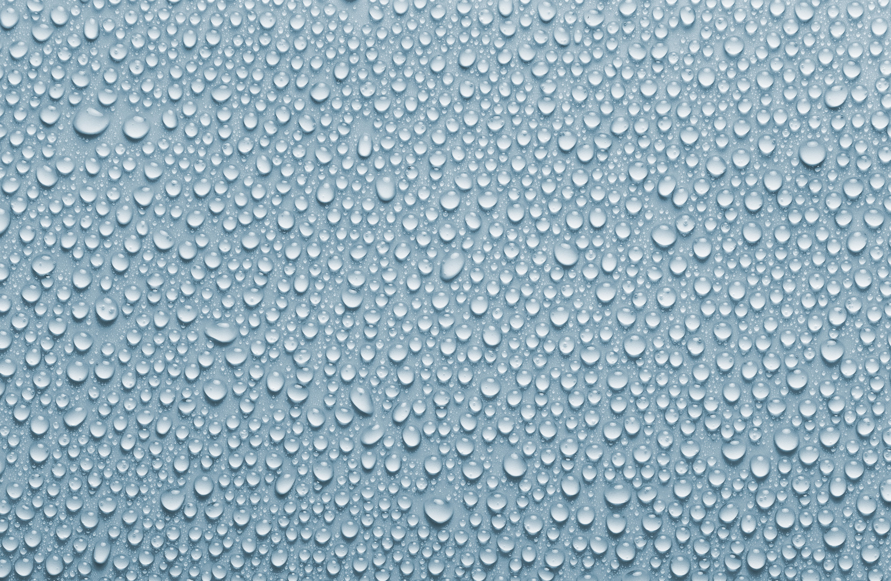 Blue colored rain drops background, an Abstract Photo by BOOCYS