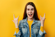 Woman makes rock n roll sign, a Person Photo by Yura_Yarema