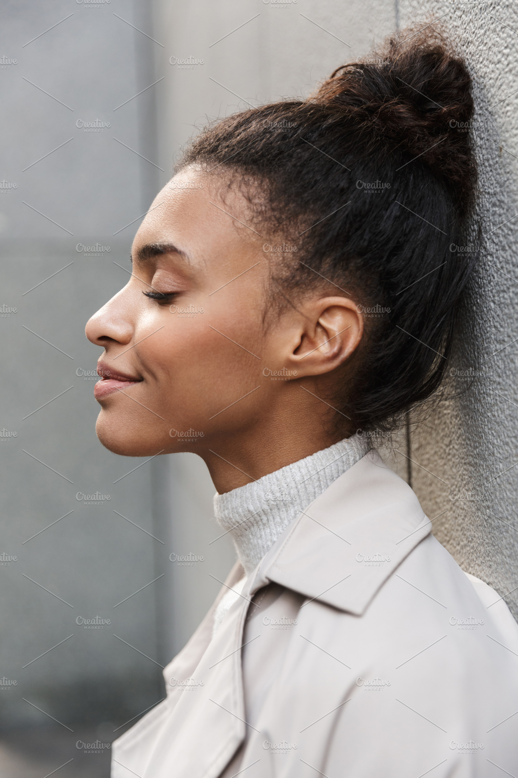 Close up side view of a smiling youn, a Person Photo by Dean Drobot