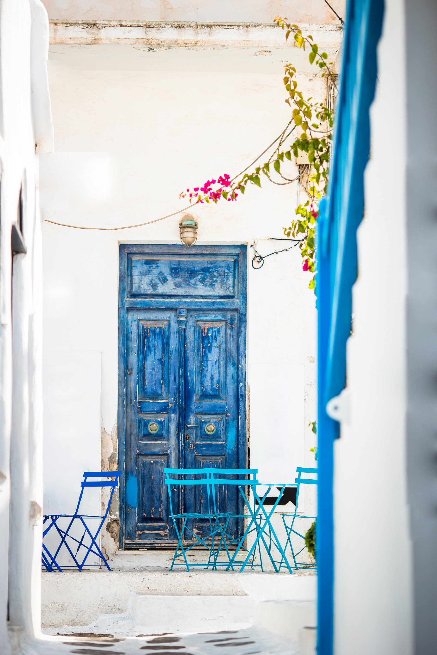 Outdoor cafe on a street of typical greek traditional village in greece ...