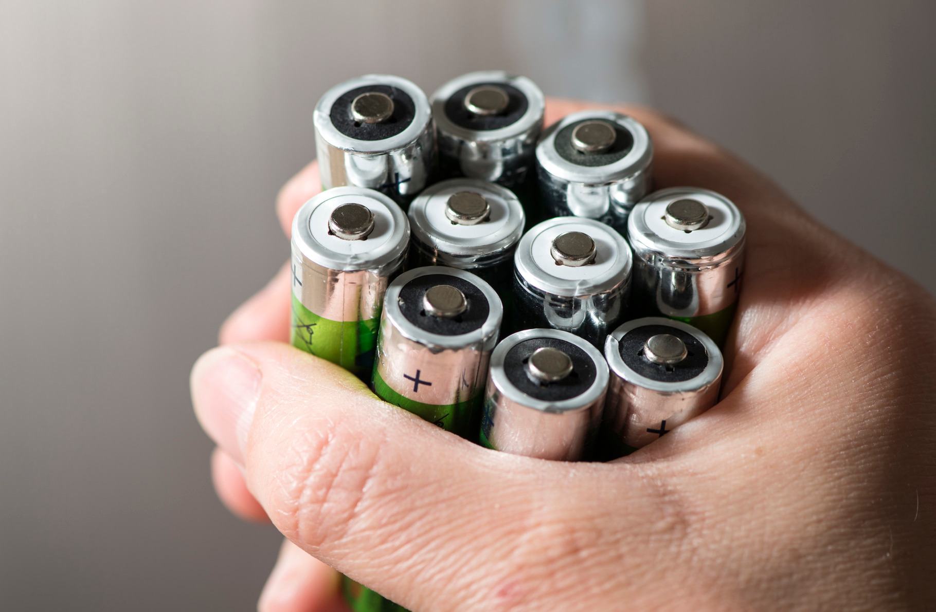Hand hold many batteries containing batteries, battery, and hand ...