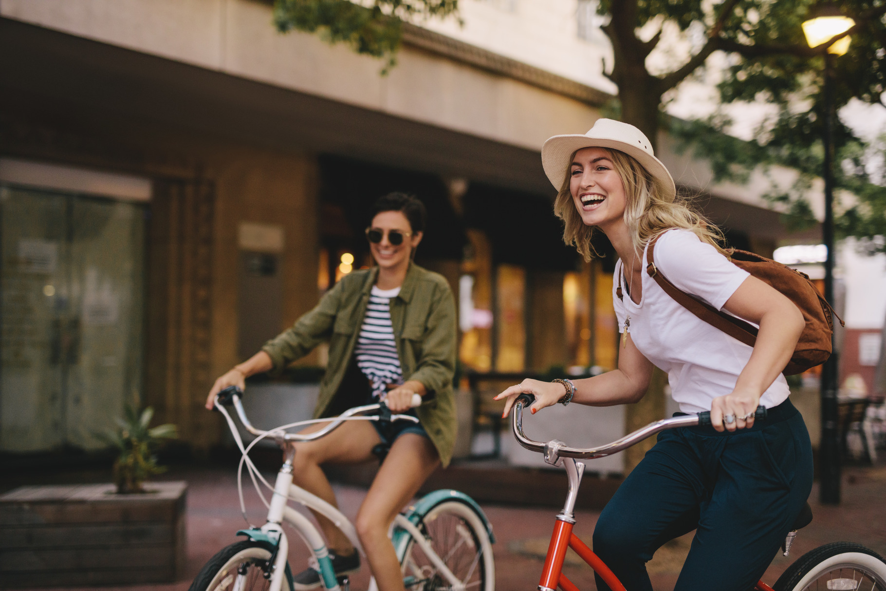 Female friends enjoying bicycle ride, a Person Photo by Jacob Lund ...
