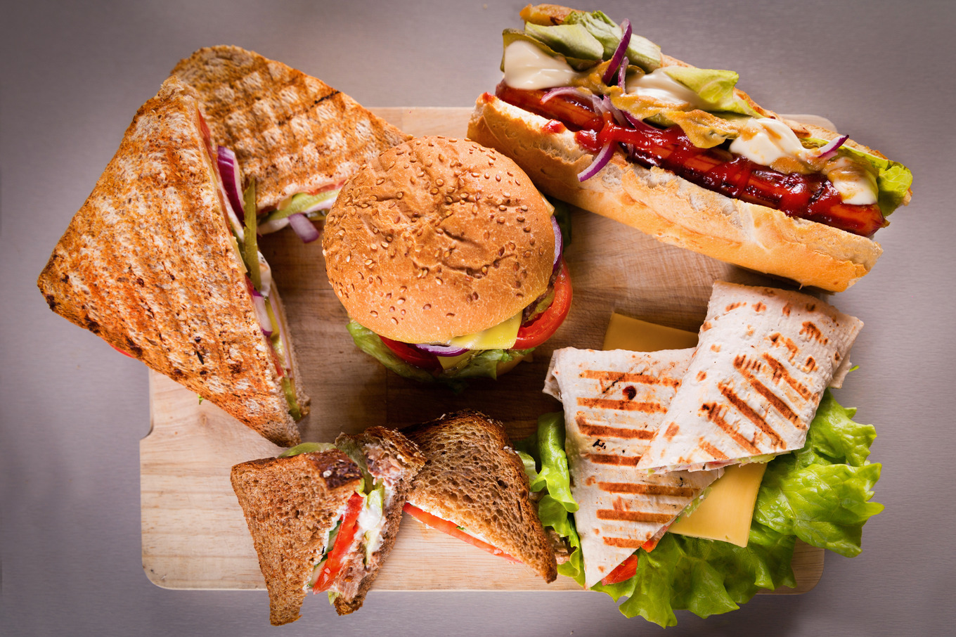 Fast food plate with burger hot dog sandwiches chicken wrap stock photo ...