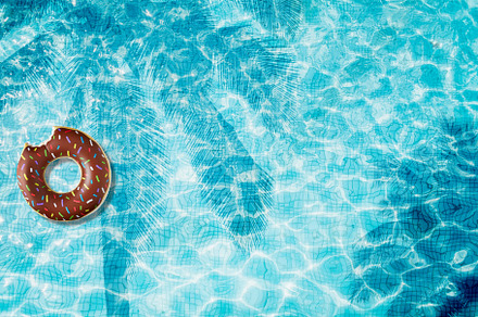 Pool float ring floating containing background, beach, and beautiful, a ...
