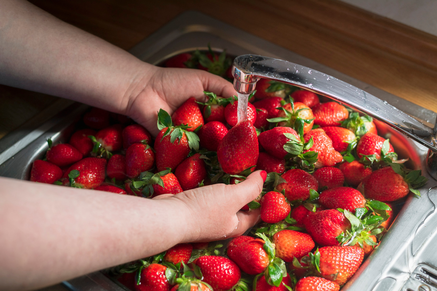 Washing strawberries underwater in, a Food & Drink Photo by ...