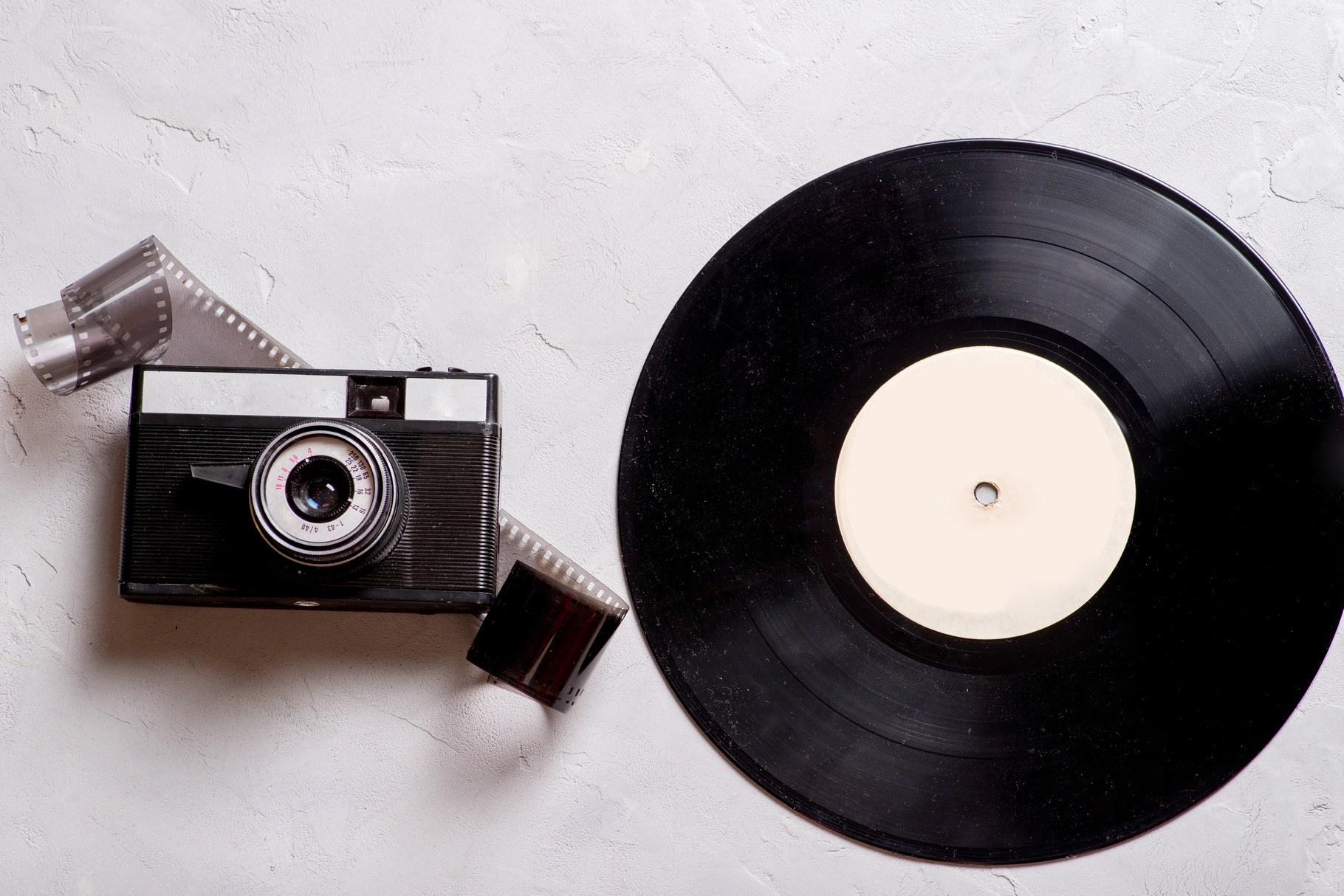 Film camera and gramophone record containing phonograph, vinyl, and ...