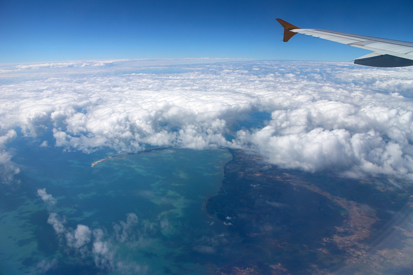 Airplane over earth, a Transportation Photo by Matilda Kohonen