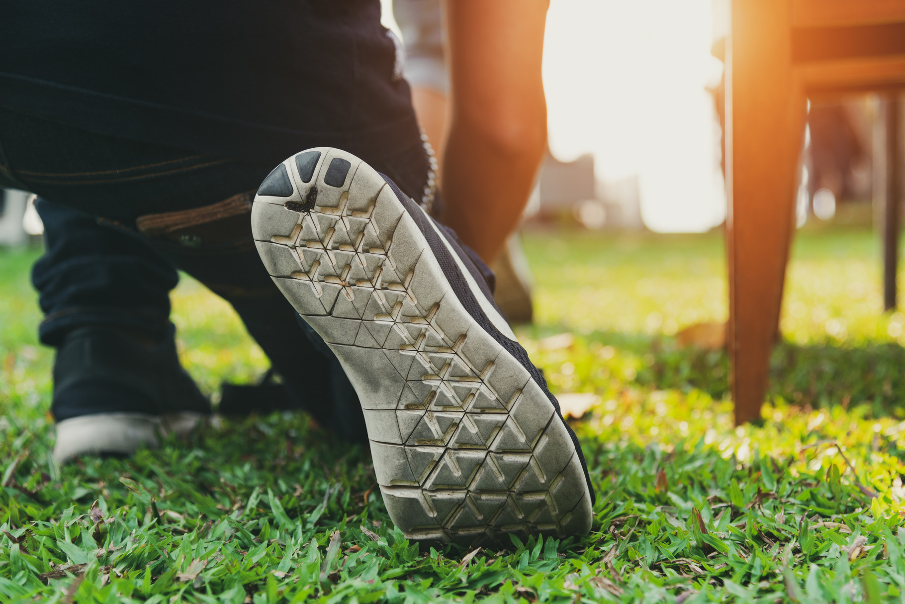 Close up of man who wearing running shoes in park before ready t, a ...