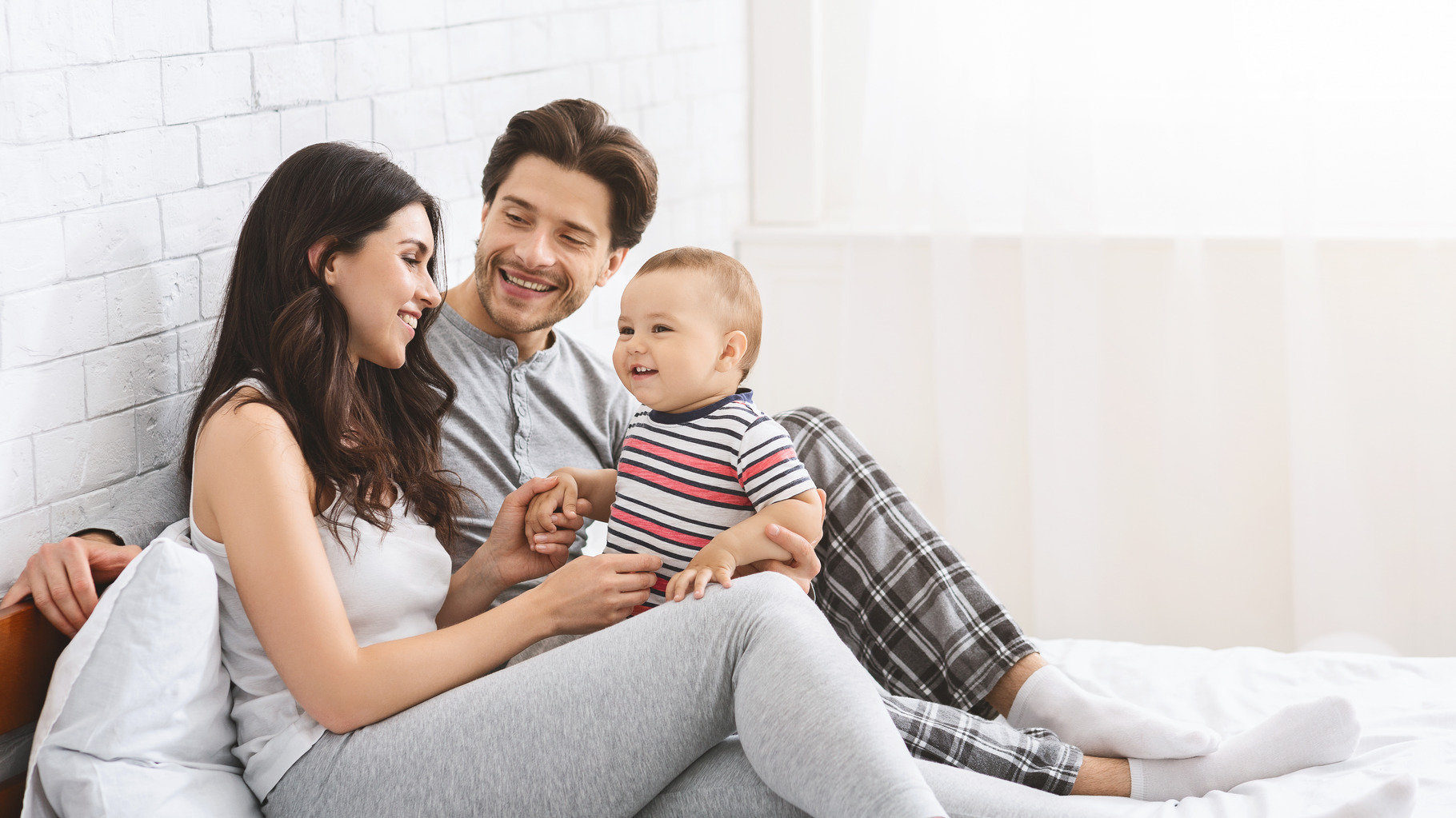 Happy millennial couple enjoying par, a Photo by Prostock-Studio