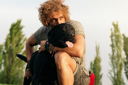 Man having fun with his dog featuring dog, man, and pet, an Animal ...