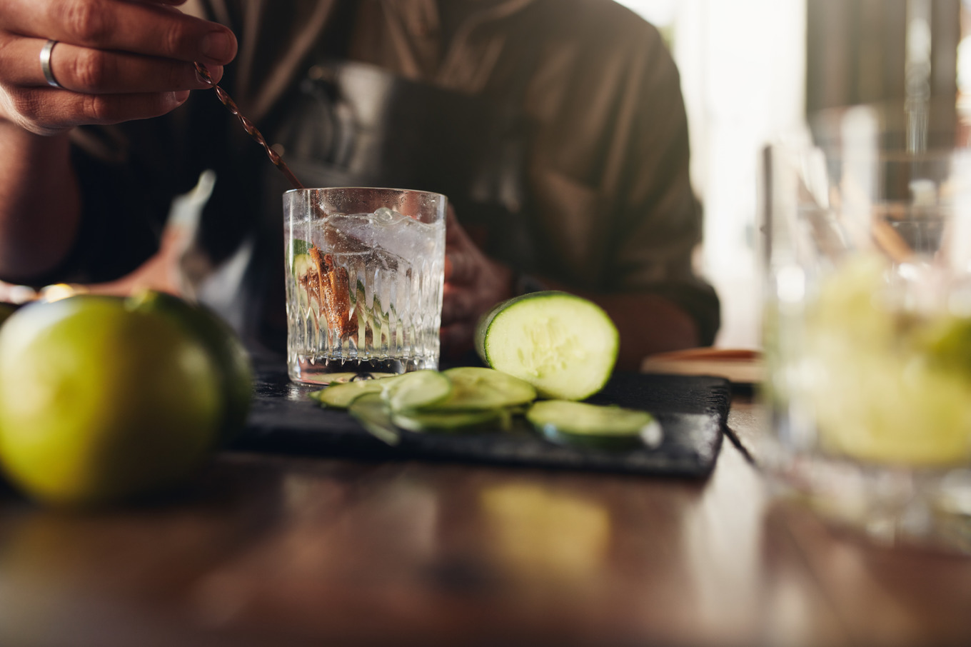 Bartender stirring a cocktail, a Food & Drink Photo by Jacob Lund