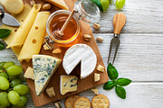 Various types of cheese on a white wooden background, a Food & Drink ...