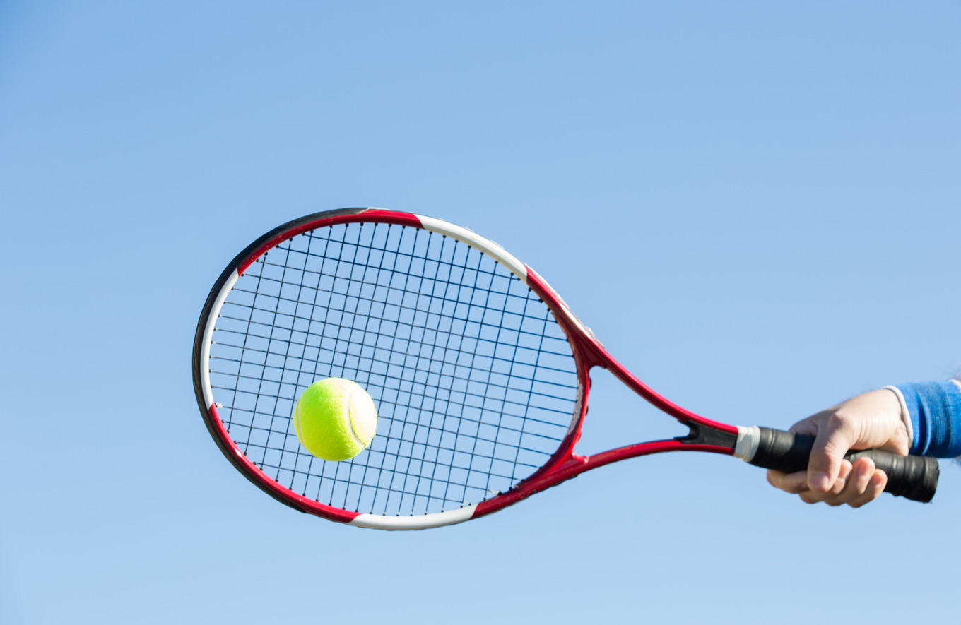 Tennis player hitting the ball containing tennis, hand, and racket, a ...